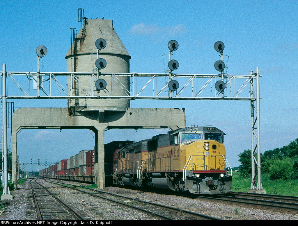 UP 6320 is e/b under the signals and coal tower,
